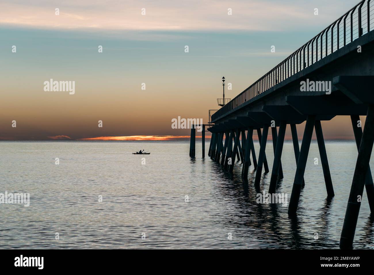 Deep into sea goes long sea pier on cruciform concrete piles, designed ...