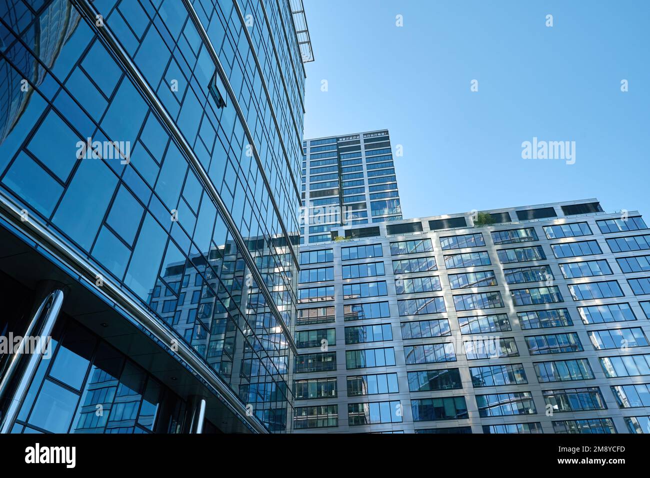 Detail of skyscraper office buildings with glass facades. Modern urban ...