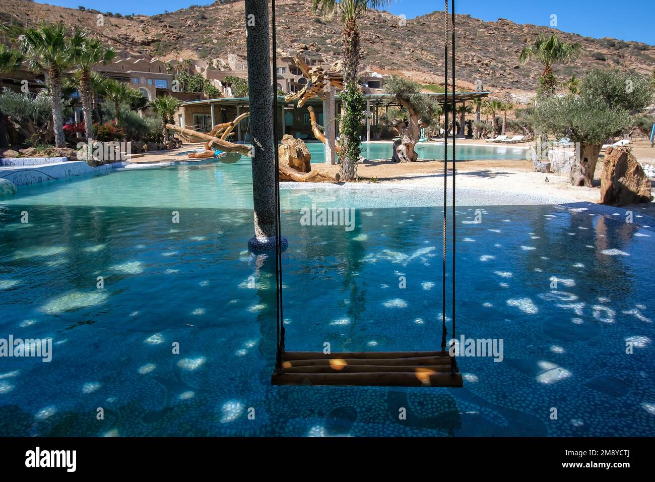 Ios, Greece - June 6, 2021 : A beautiful decorated swimming pool with a ...