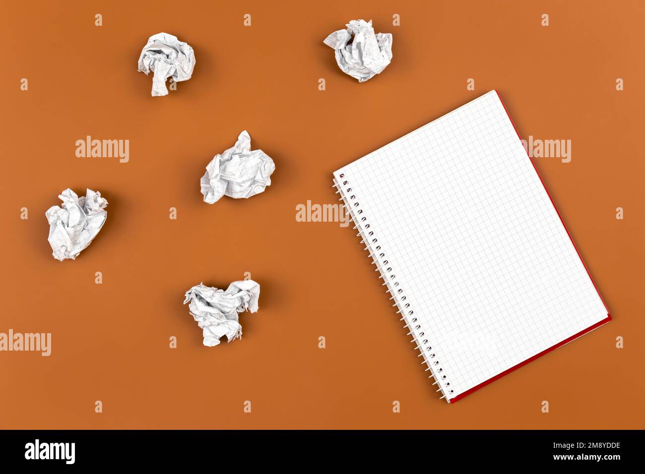 Empty notebook and crumpled paper balls, flat lay Stock Photo - Alamy