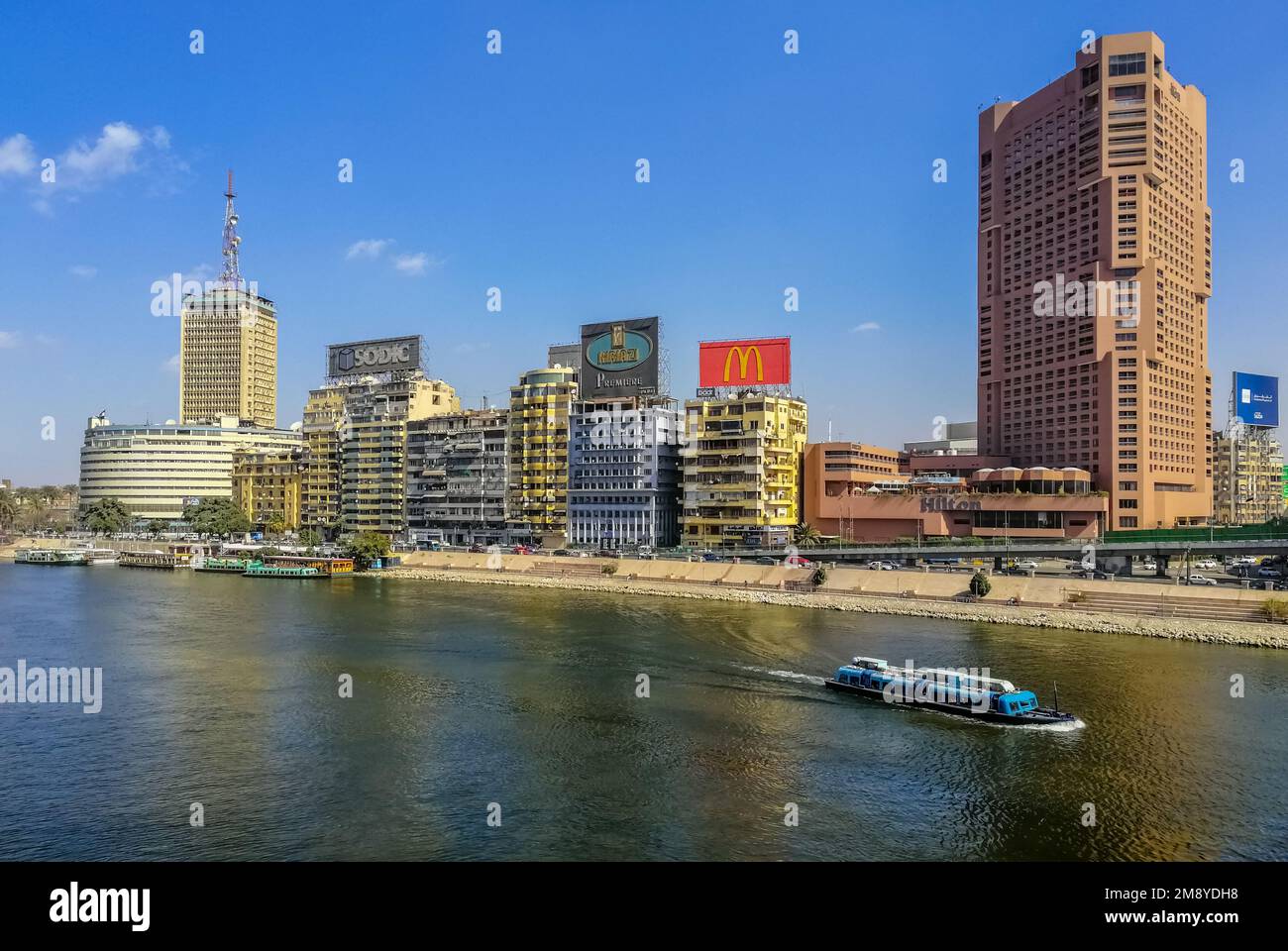 A beautiful morning view of modern buildings from a Nile river shore in ...