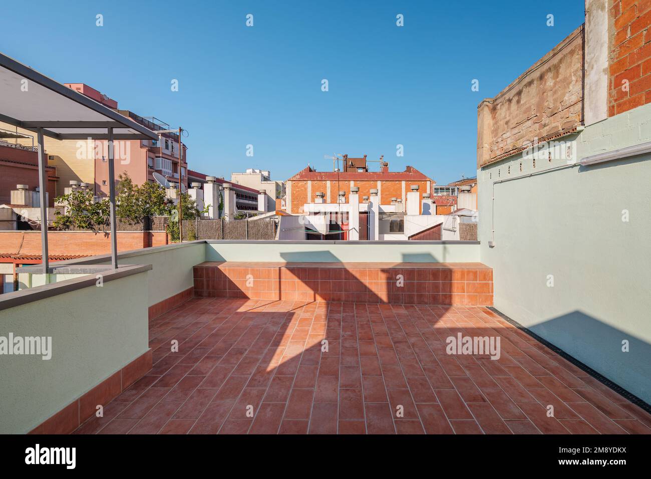 Luxurious terrace on a roof lined with red brick tiles overlooking the ...