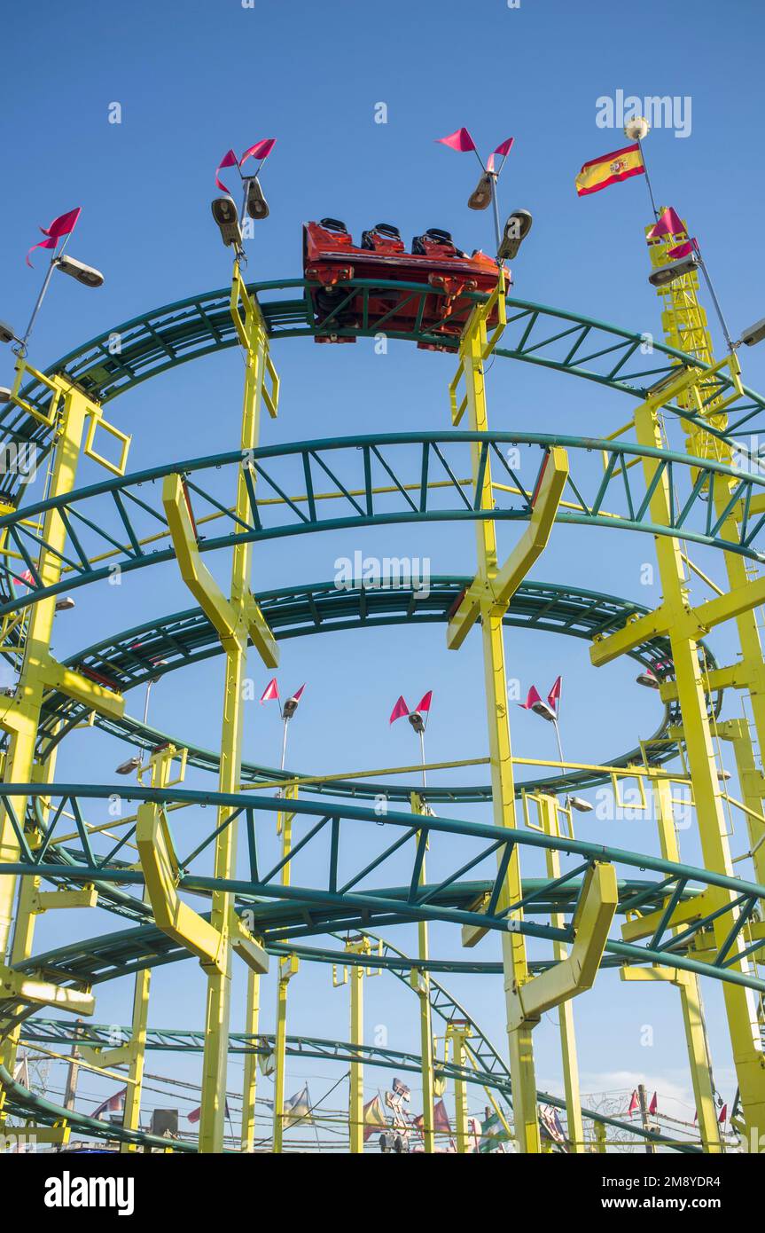 Roller coaster circles structure. Funfair attraction over blue sky seen ...