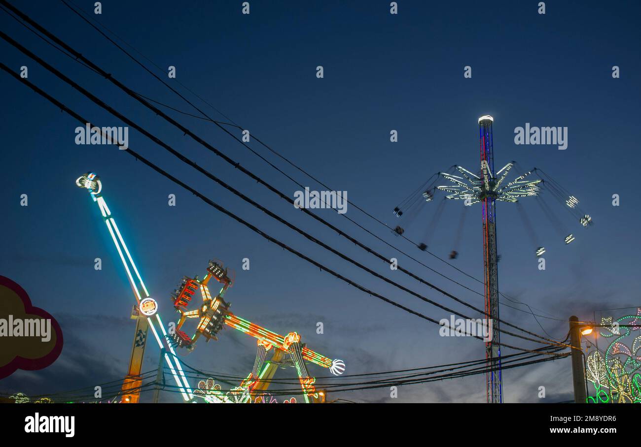 Fairground skyline full of lectrical wires and poles. Night scene Stock ...