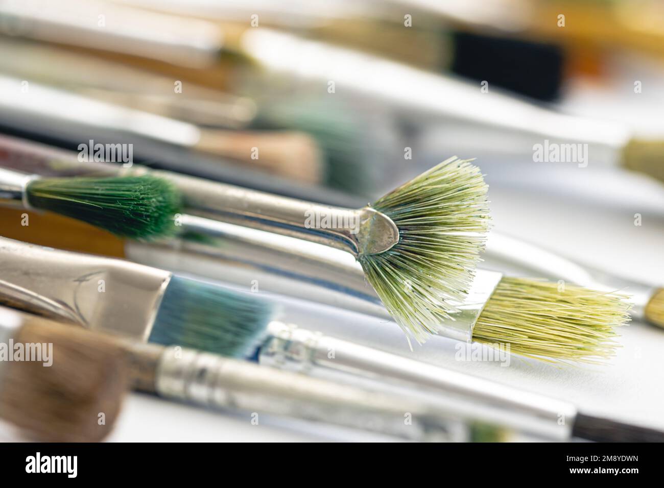 Paint brushes stained with paint, close-up, macro shot Stock Photo - Alamy