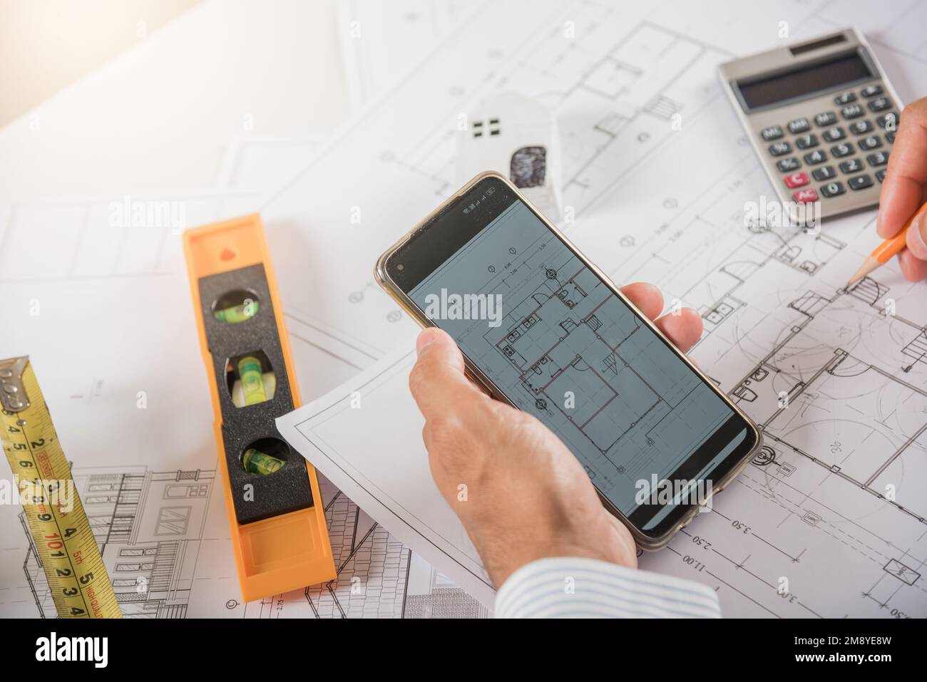 Architectural building design and construction plans with blueprints ...