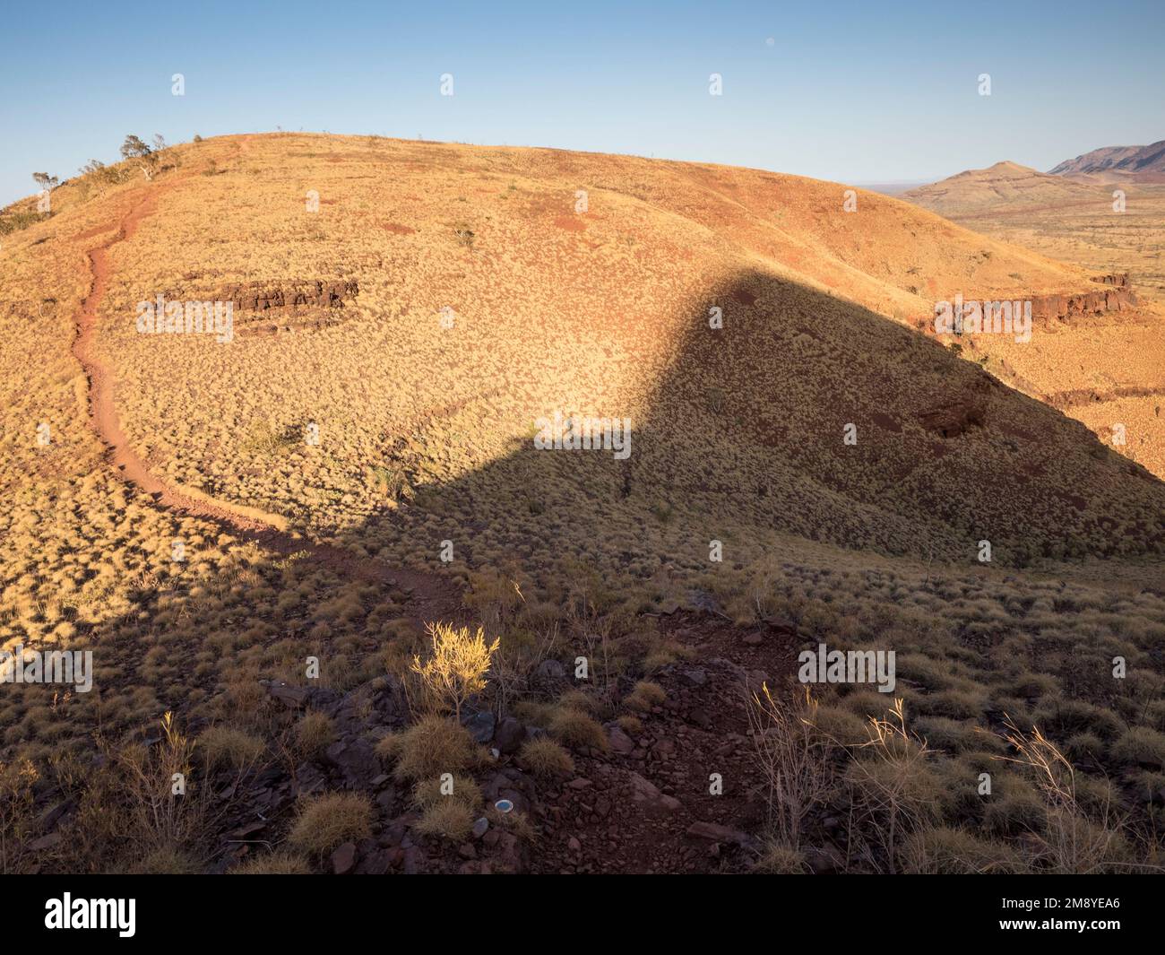 Mount Bruce (Punurrunha) summit shadow over the walking track along the ...