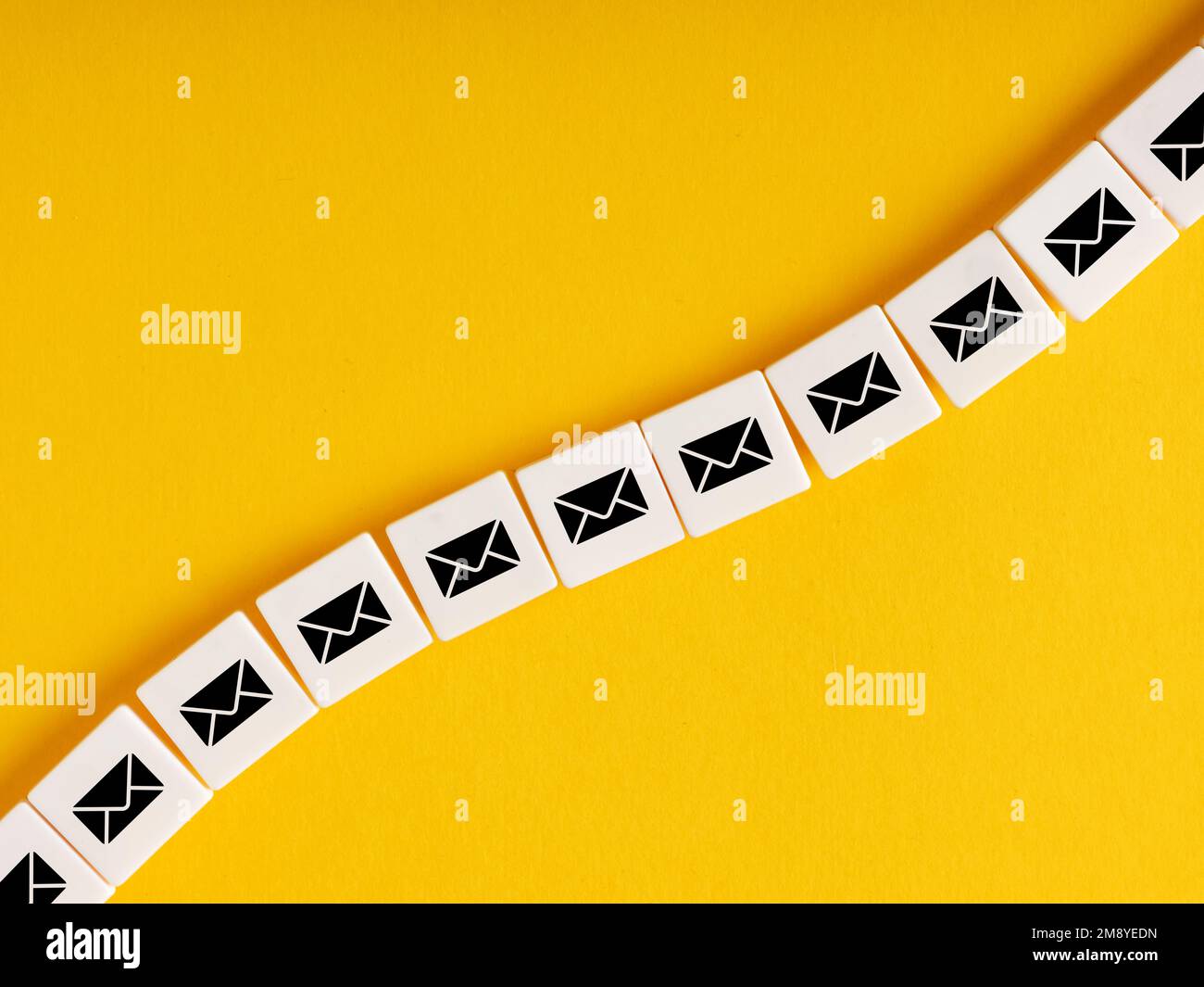 Cubes with chain mail icons on yellow background. Spamming, spam email ...
