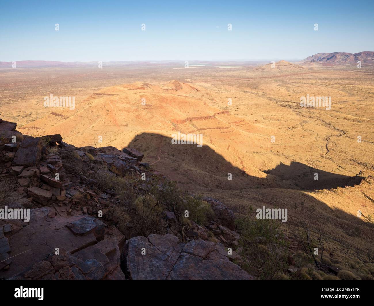 The summit plateau throws a shadow over the track on the western ridge ...