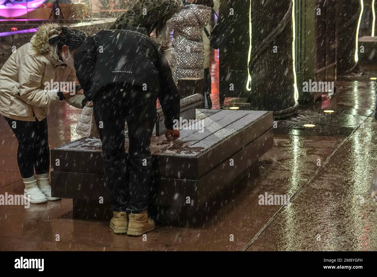 Tourists visit the Grand Tang Mall in the snow in Xi'an City, northwest ...