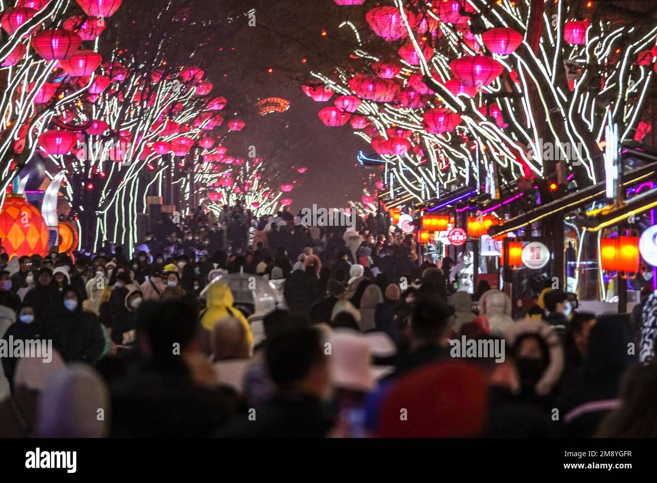 Tourists visit the Grand Tang Mall in the snow in Xi'an City, northwest ...
