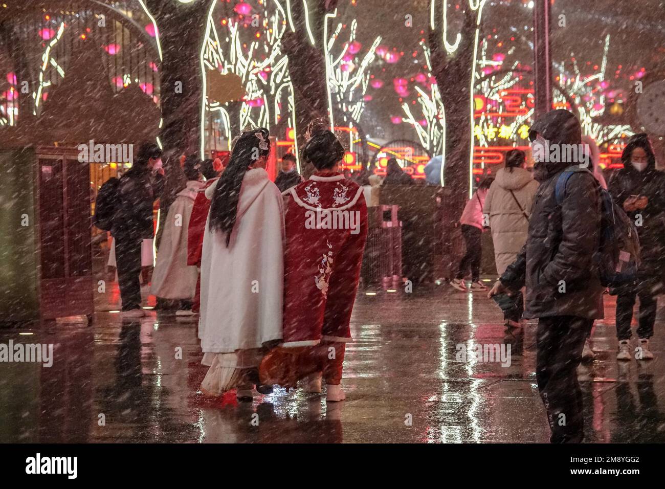 Tourists visit the Grand Tang Mall in the snow in Xi'an City, northwest ...