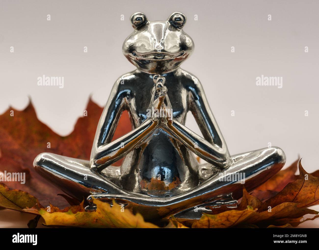 A beautiful view of a frog metal statue on white background Stock Photo ...