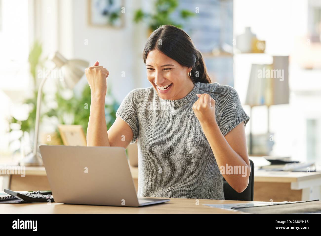 She is ready to make a change. a young businesswoman cheering in ...