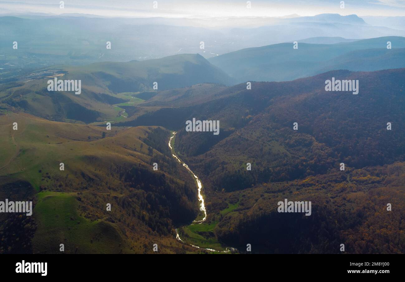An aerial view of a river between hills Stock Photo - Alamy