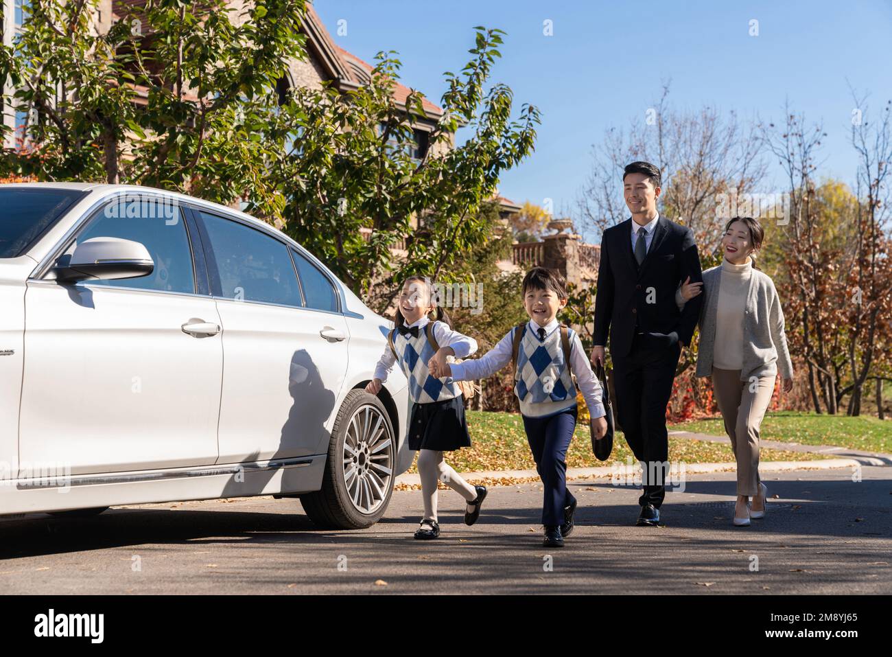A young couple to send their children to school Stock Photo - Alamy