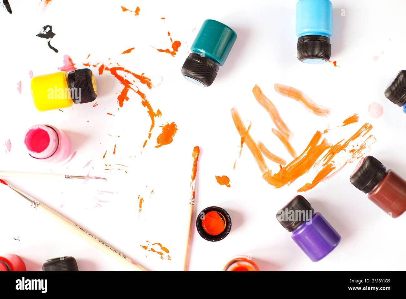 multicolored acrylic paints on a table with brushes. DIY Stock Photo ...
