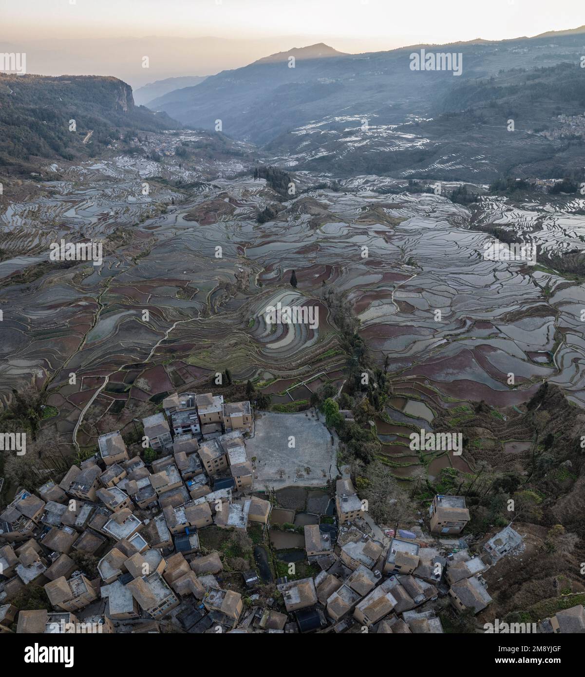 Aerial view of rice terraces and remote village in China Stock Photo ...