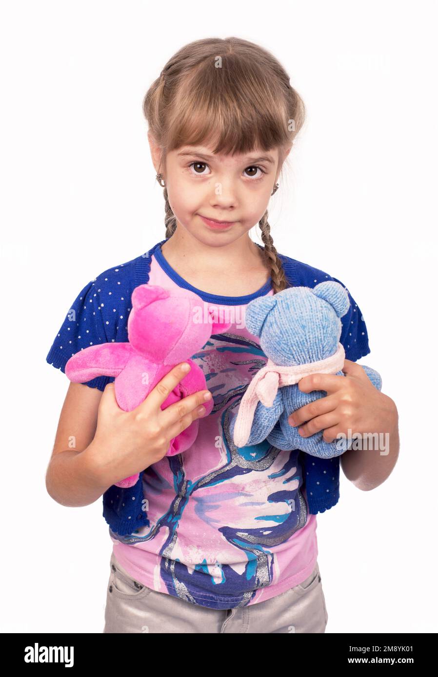 Little girl holding a teddy bear. Isolated on white background. Girl hugging two teddybears ...