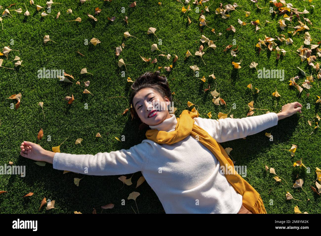 Asian lie on grass hi-res stock photography and images - Alamy