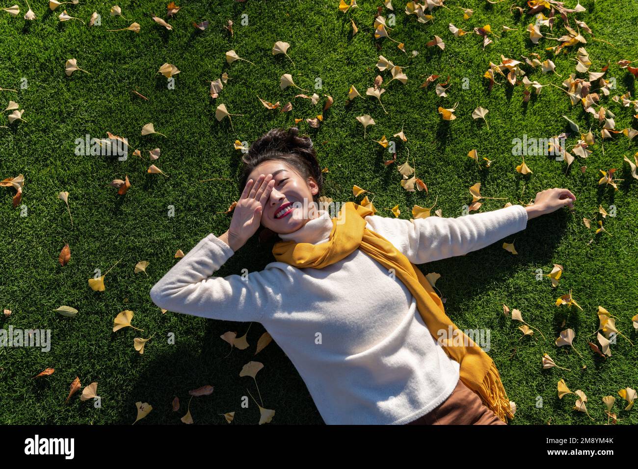 Asian lie on grass hi-res stock photography and images - Alamy
