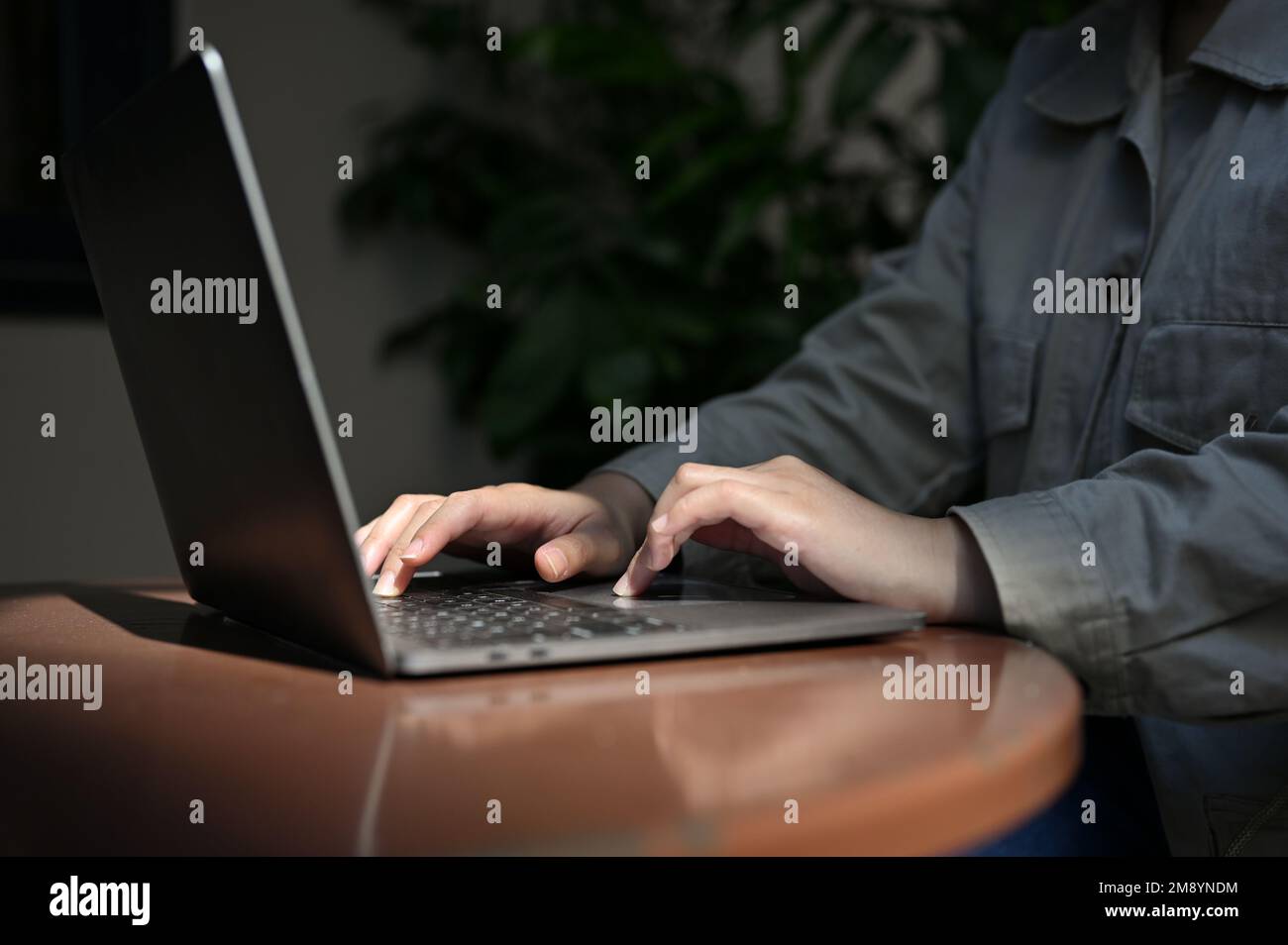 cropped and close-up hand image, A female freelancer using her portable ...