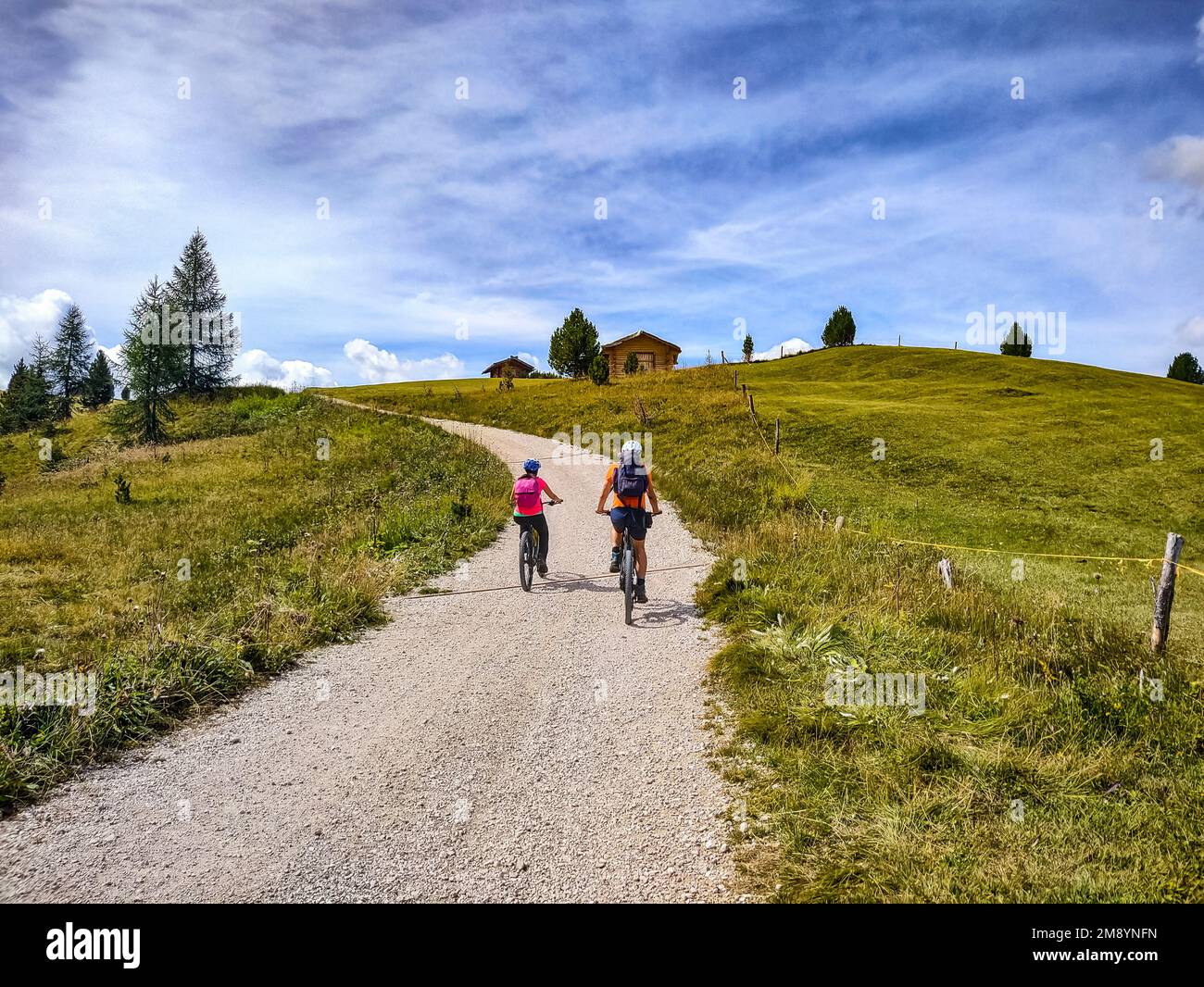 Cycling scene on the dolomites Stock Photo - Alamy