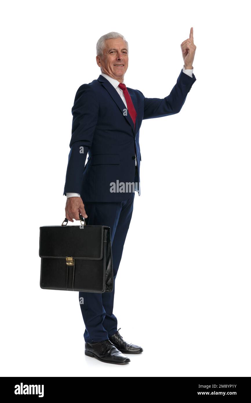 Full body picture of an old business man pointing up and holding a ...