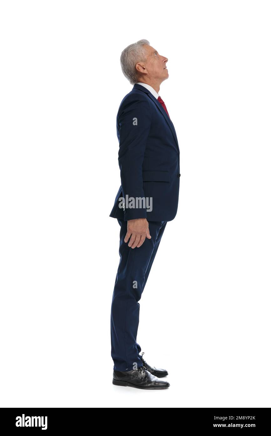 full body picture and side view of an old businessman looking up and ...