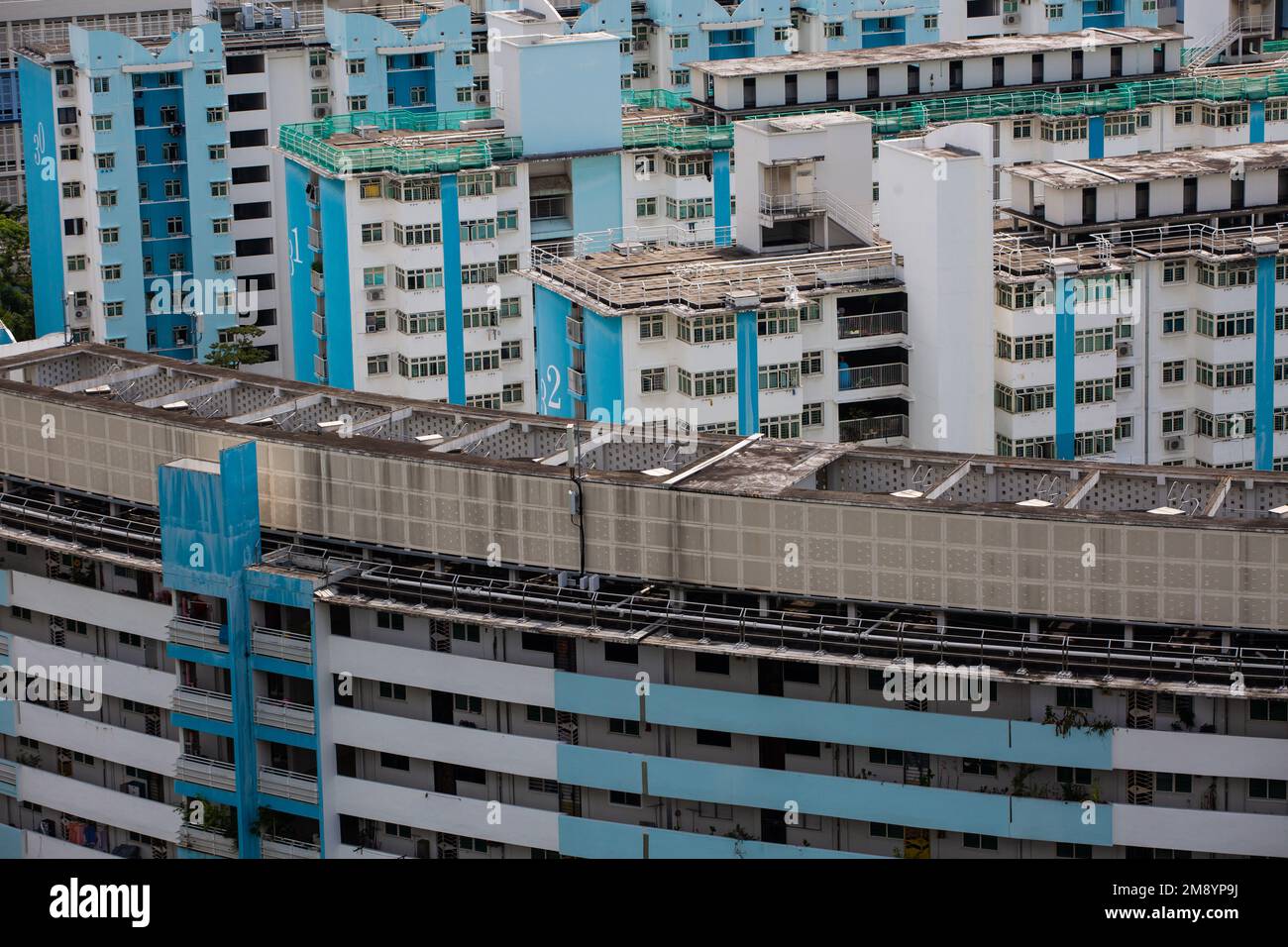 Aerial close up view of Singapore HDB housing painted in blue colour ...