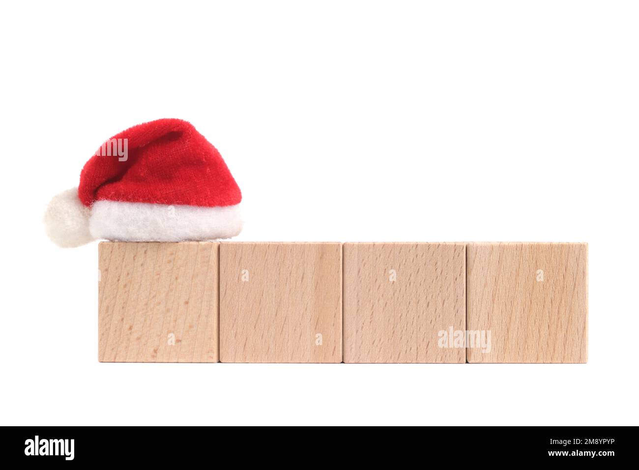 Wooden cubes and Santa Claus hat on a white background Stock Photo - Alamy