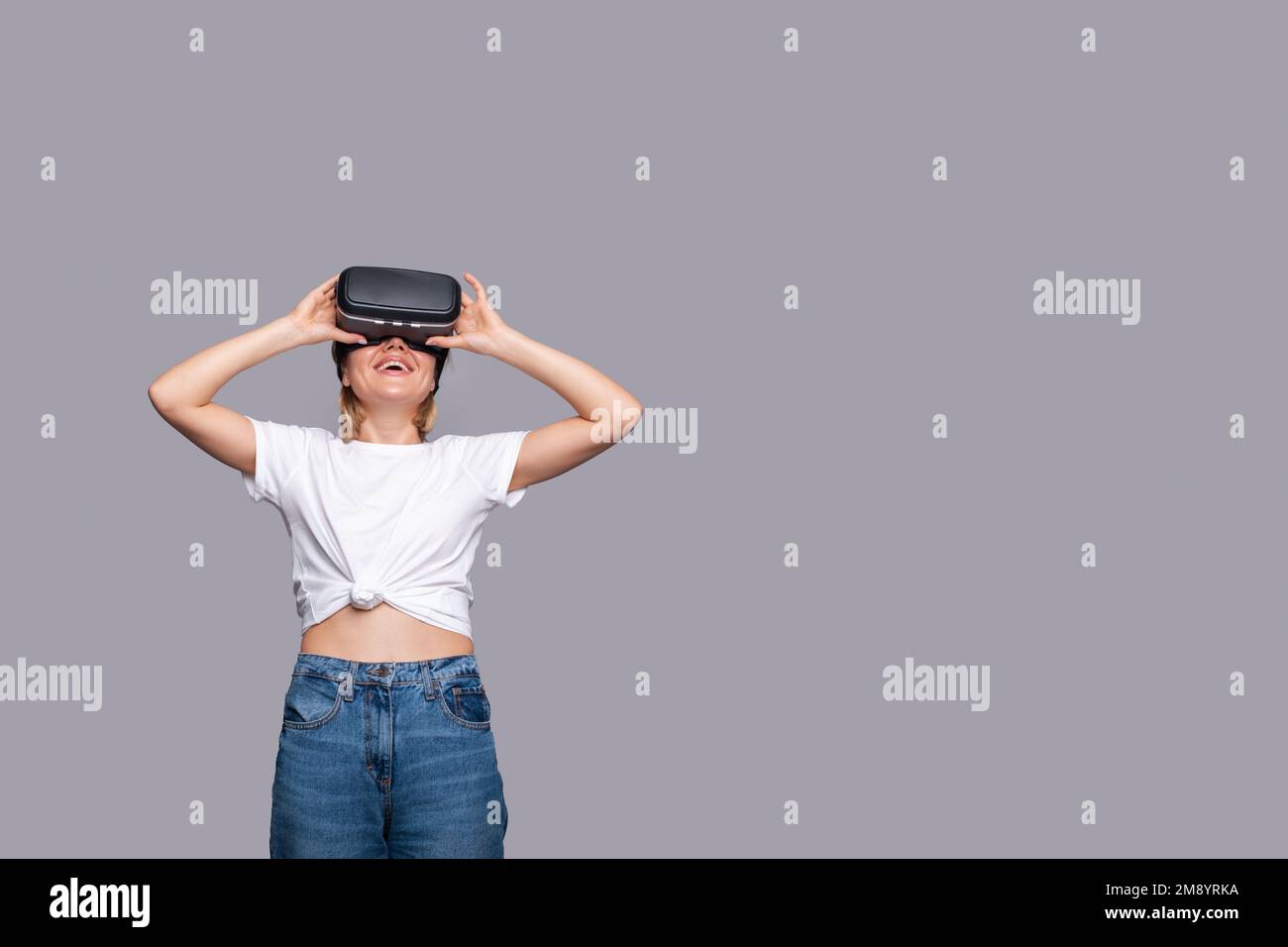 Smile happy woman getting experience using VR-headset glasses of ...