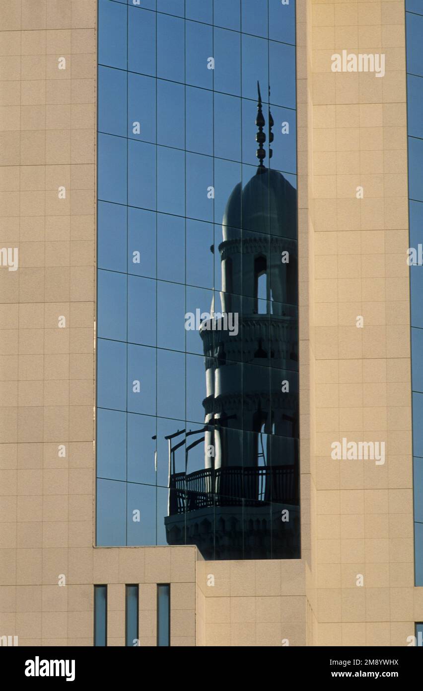 Bahrain, Manama, the Batelco building and mosque reflection Stock Photo ...