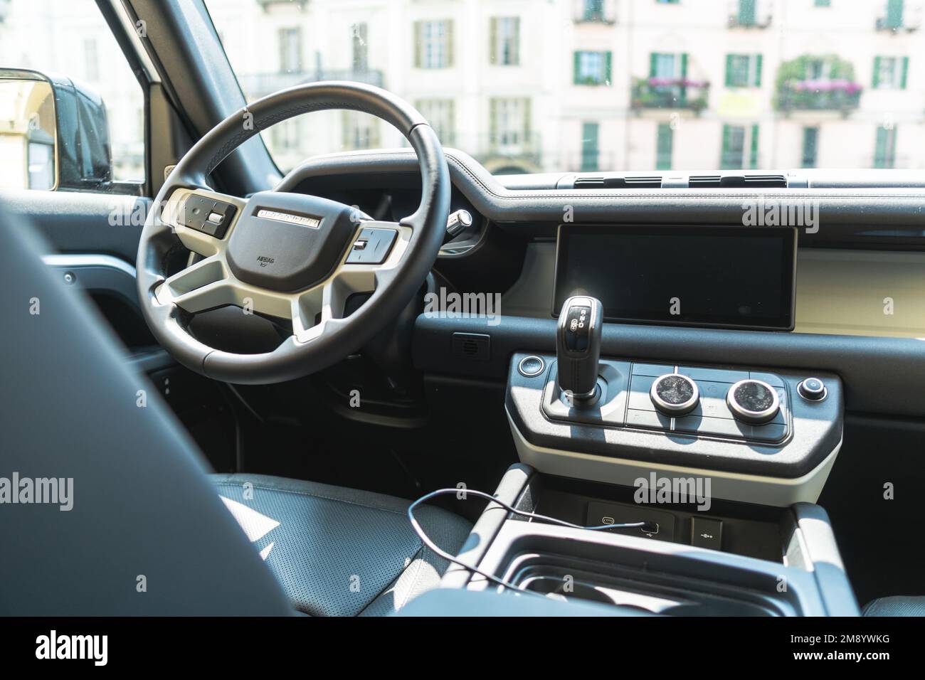 A closeup of steering wheel of the new Range Rover defender Stock Photo ...