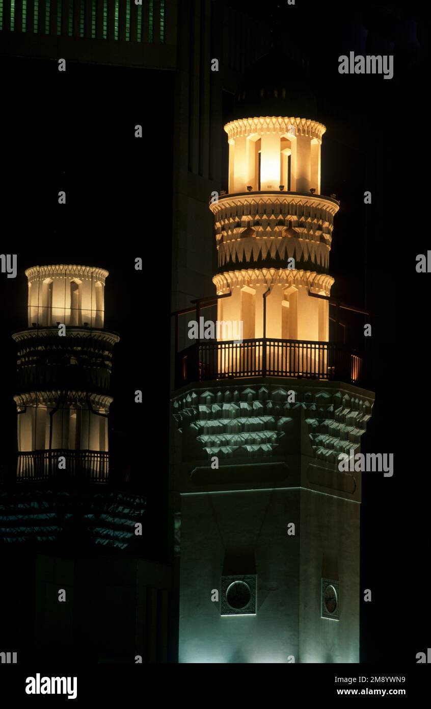 Bahrain, the Batelco building and mosque at night Stock Photo - Alamy