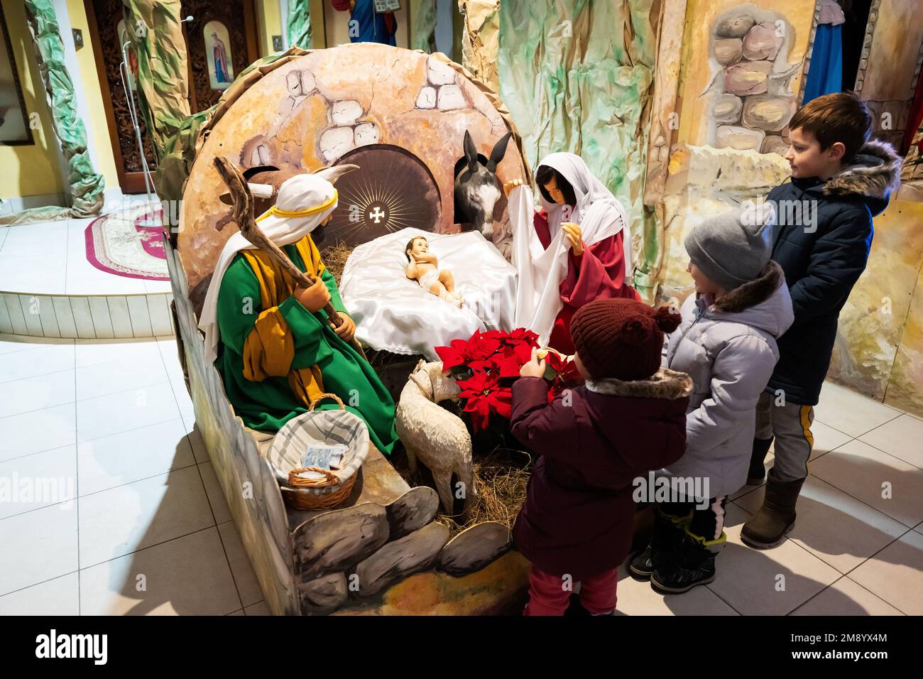 Christmas nativity crib scene in church. Kids visit stable with baby ...