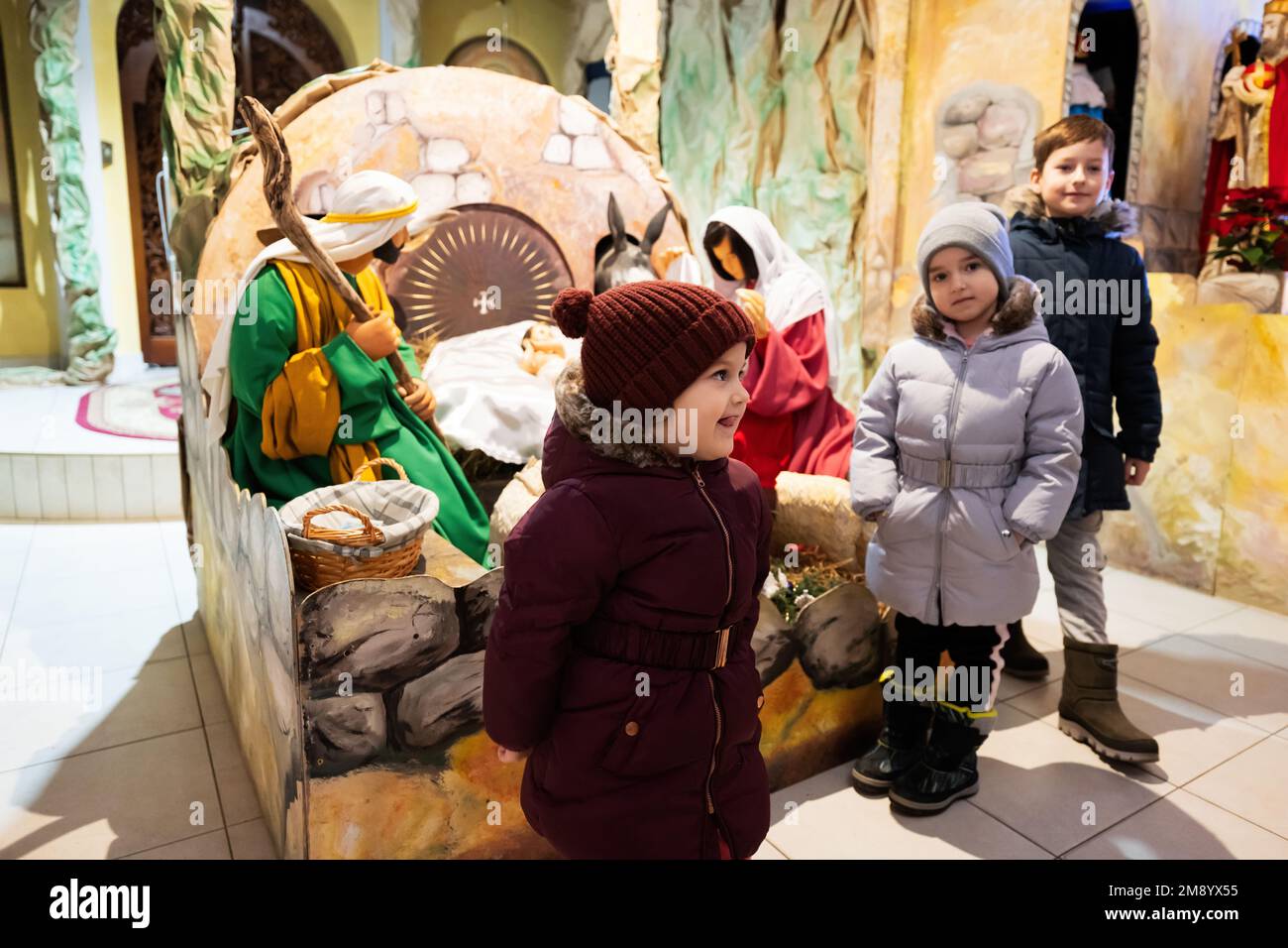 Christmas nativity crib scene in church. Kids visit stable with baby ...
