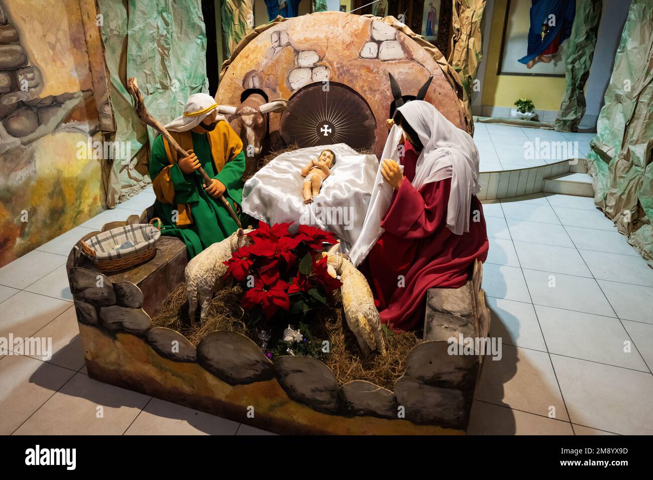 Christmas nativity crib scene in church. Stable with baby Jesus in a ...