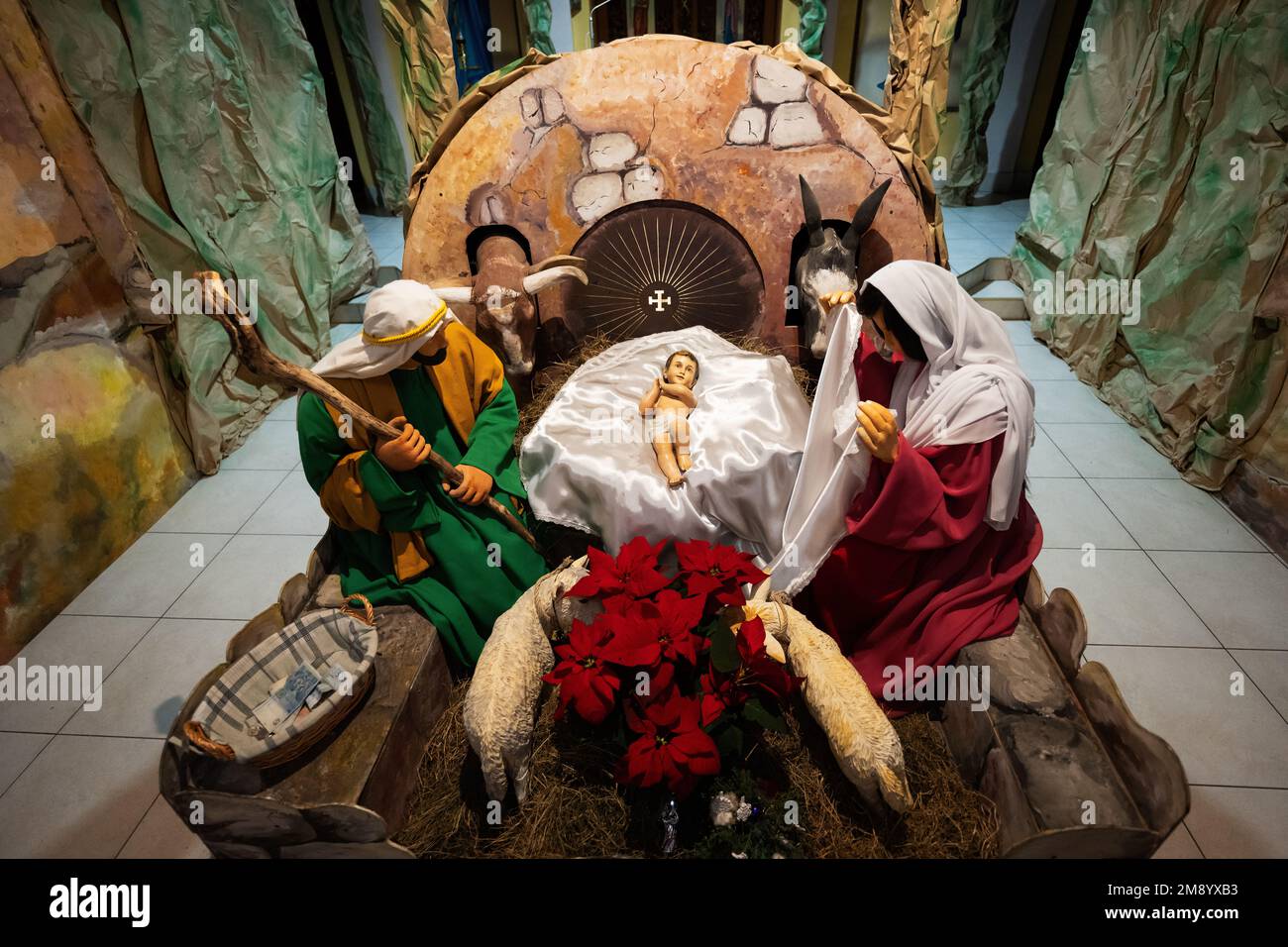 Christmas nativity crib scene in church. Stable with baby Jesus in a ...