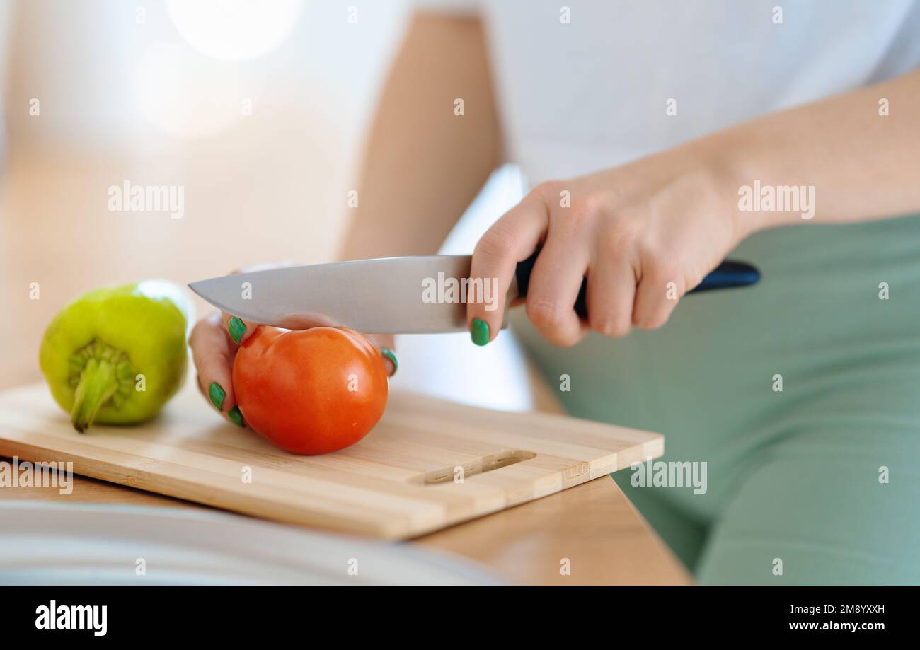 Healthy food at home. Woman is preparing the proper meal in the kitchen ...