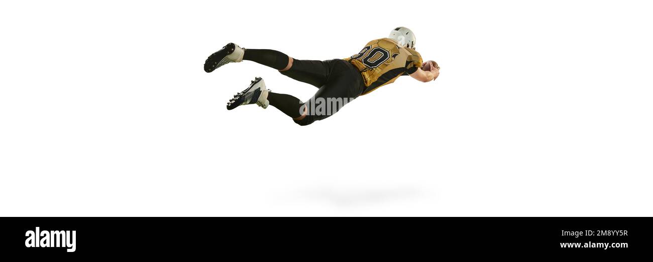 Catching ball in a flight. Man, american football player in motion ...