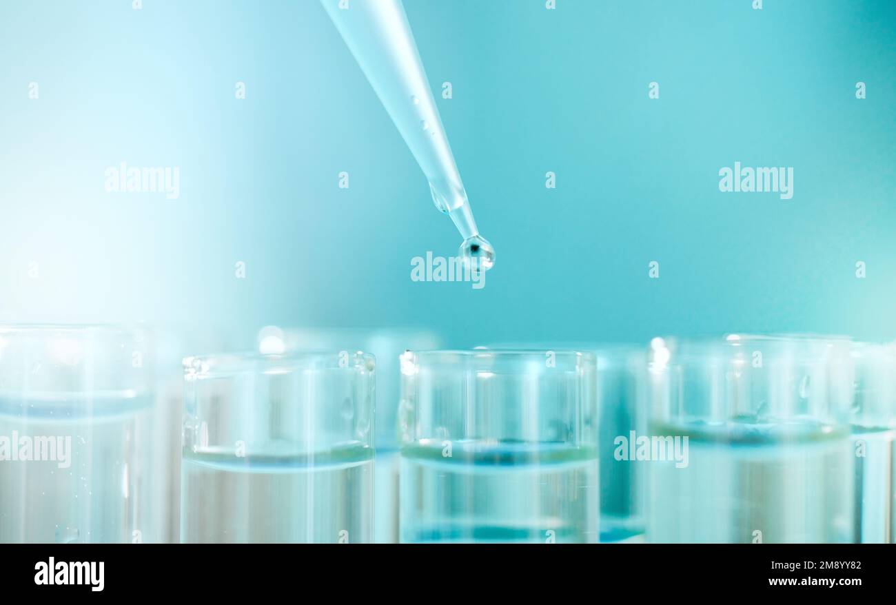 A small drop goes a long way. a dropper and beakers in a laboratory ...