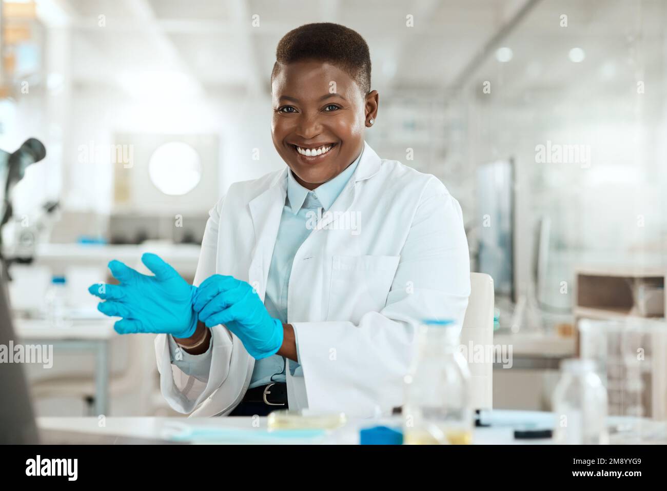 Im ready to get to work. an attractive young scientist sitting alone in ...