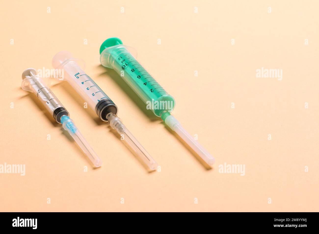 Top view of different syringes for injection on colorful background ...