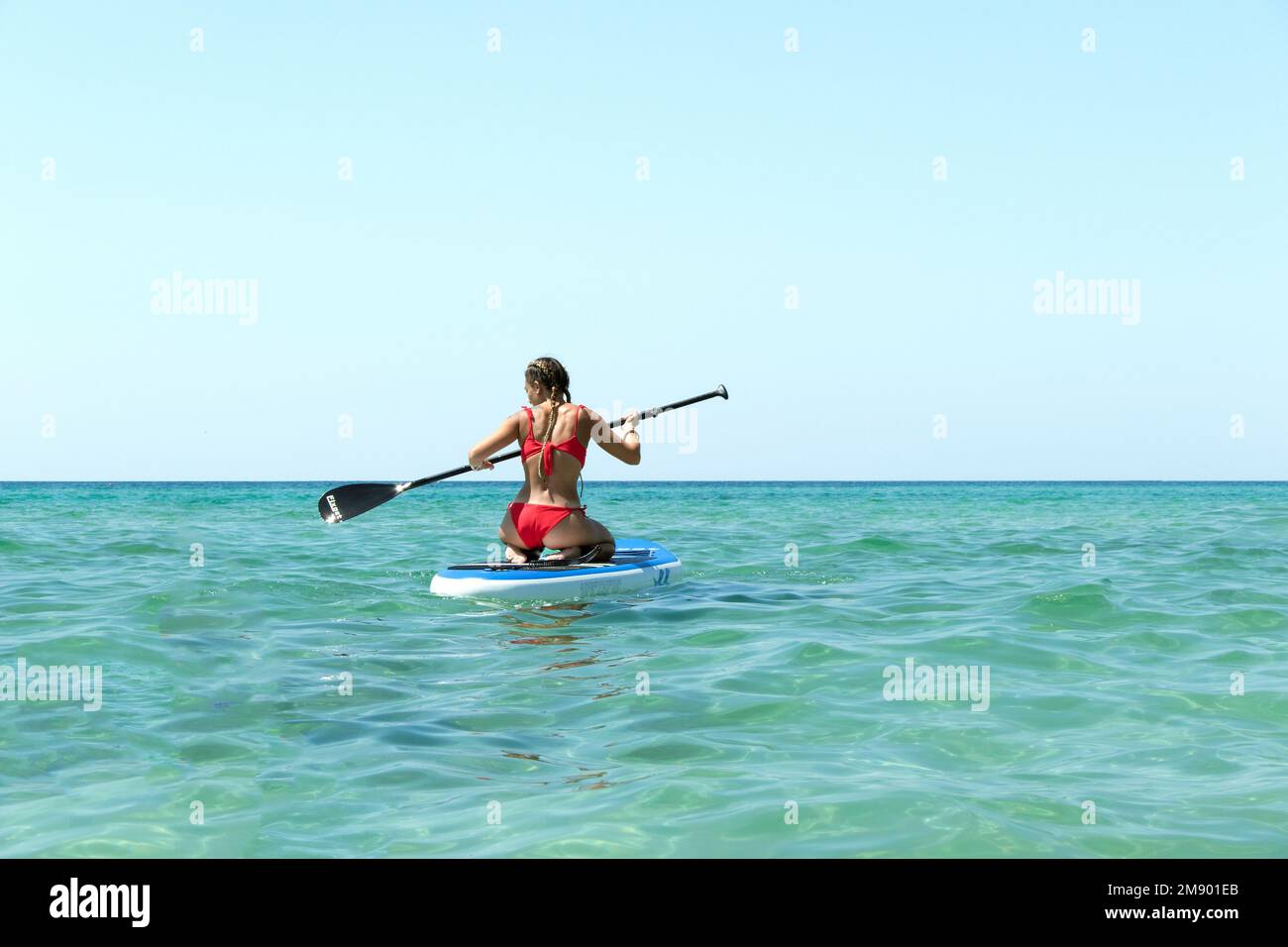 Woman on a sup Stock Photo - Alamy