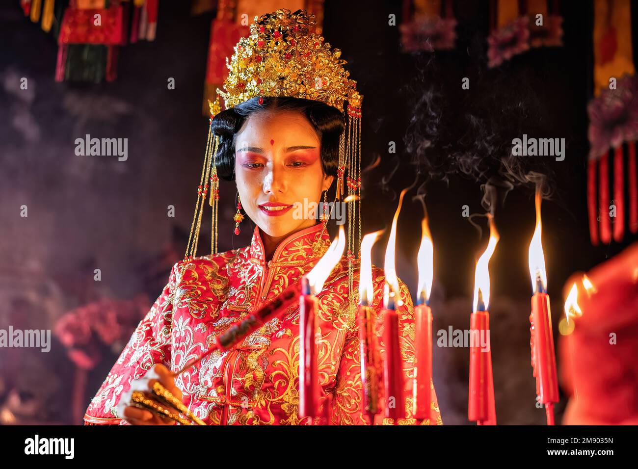 Girl traditional dress in Chinese pray in temple translation language ...