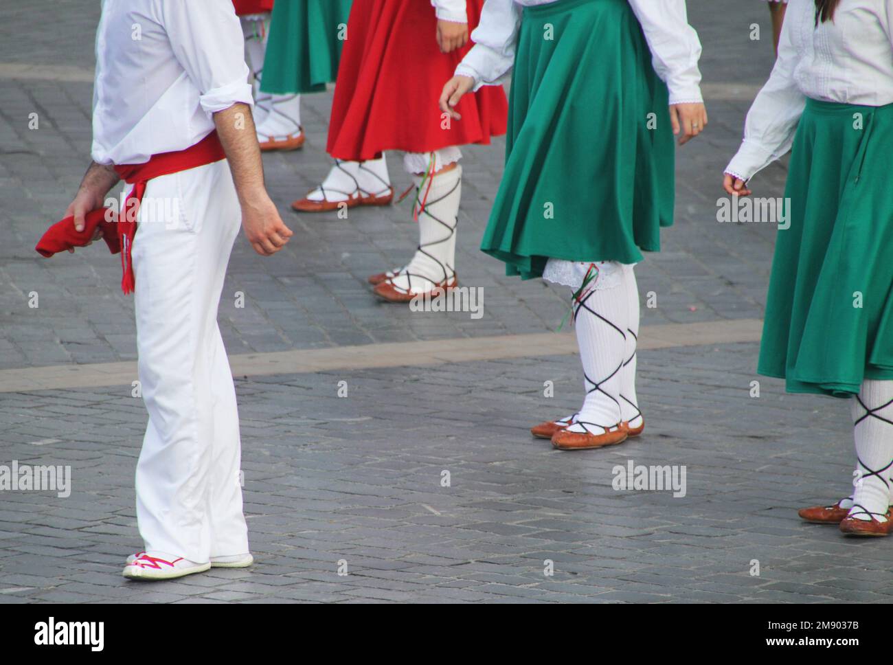 A group of dancers dancing a Basque dance during the folk dance outdoor ...