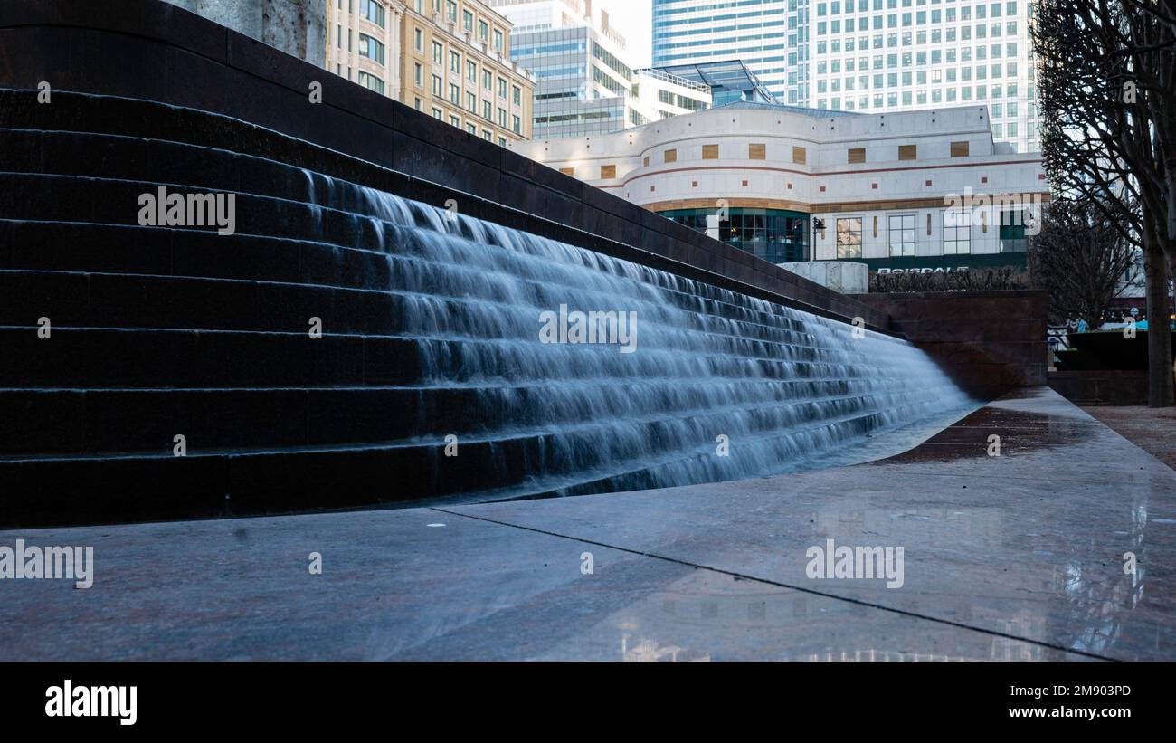 London - 01 26 2022: Cascade fountain and Cabot Square in the ...
