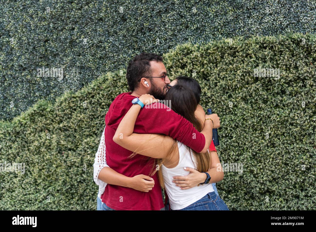 Hispanic Friends greet each other at a party Stock Photo - Alamy
