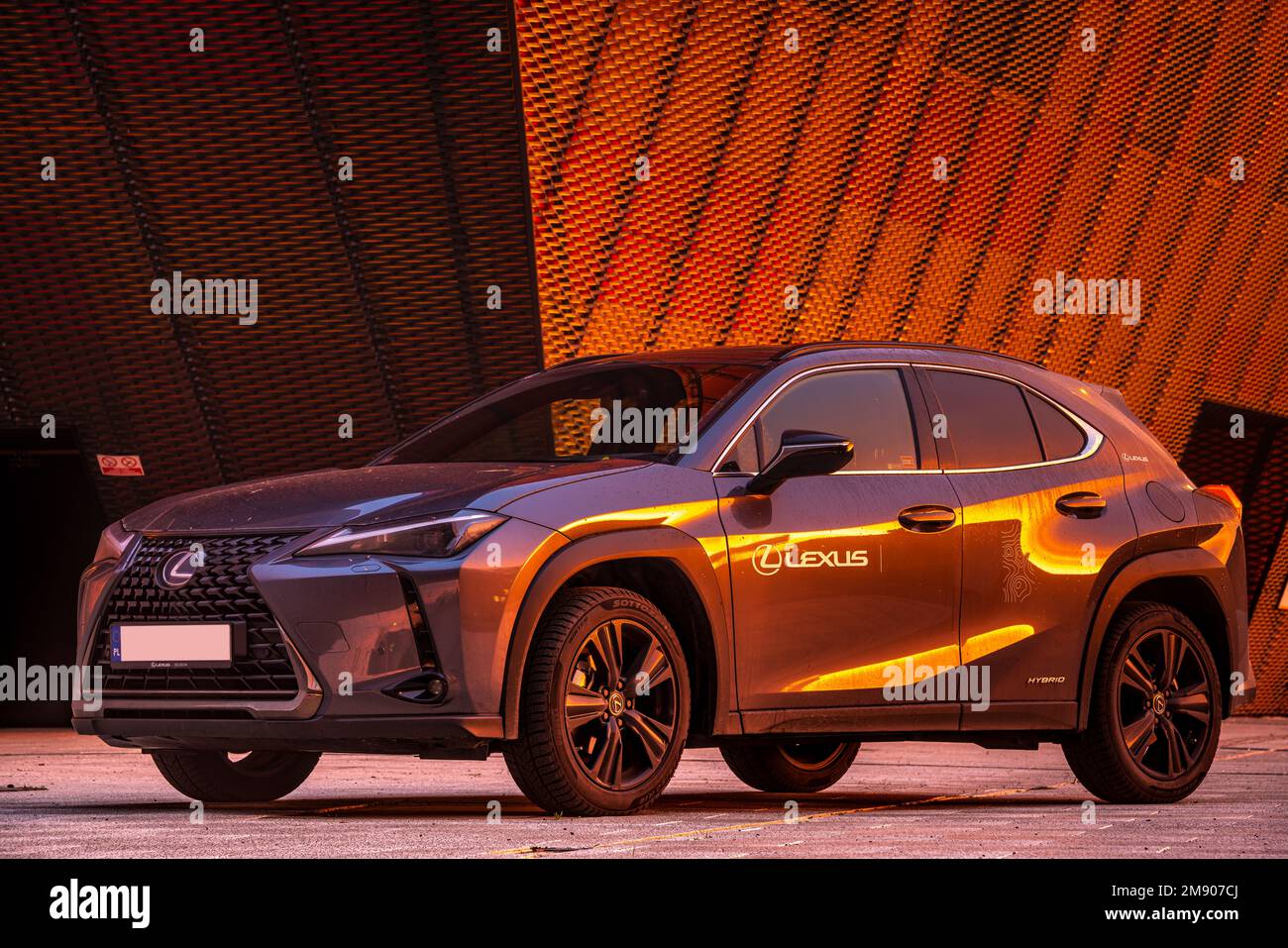 Lexus UX hybrid SUV against the background of a modern building in the ...